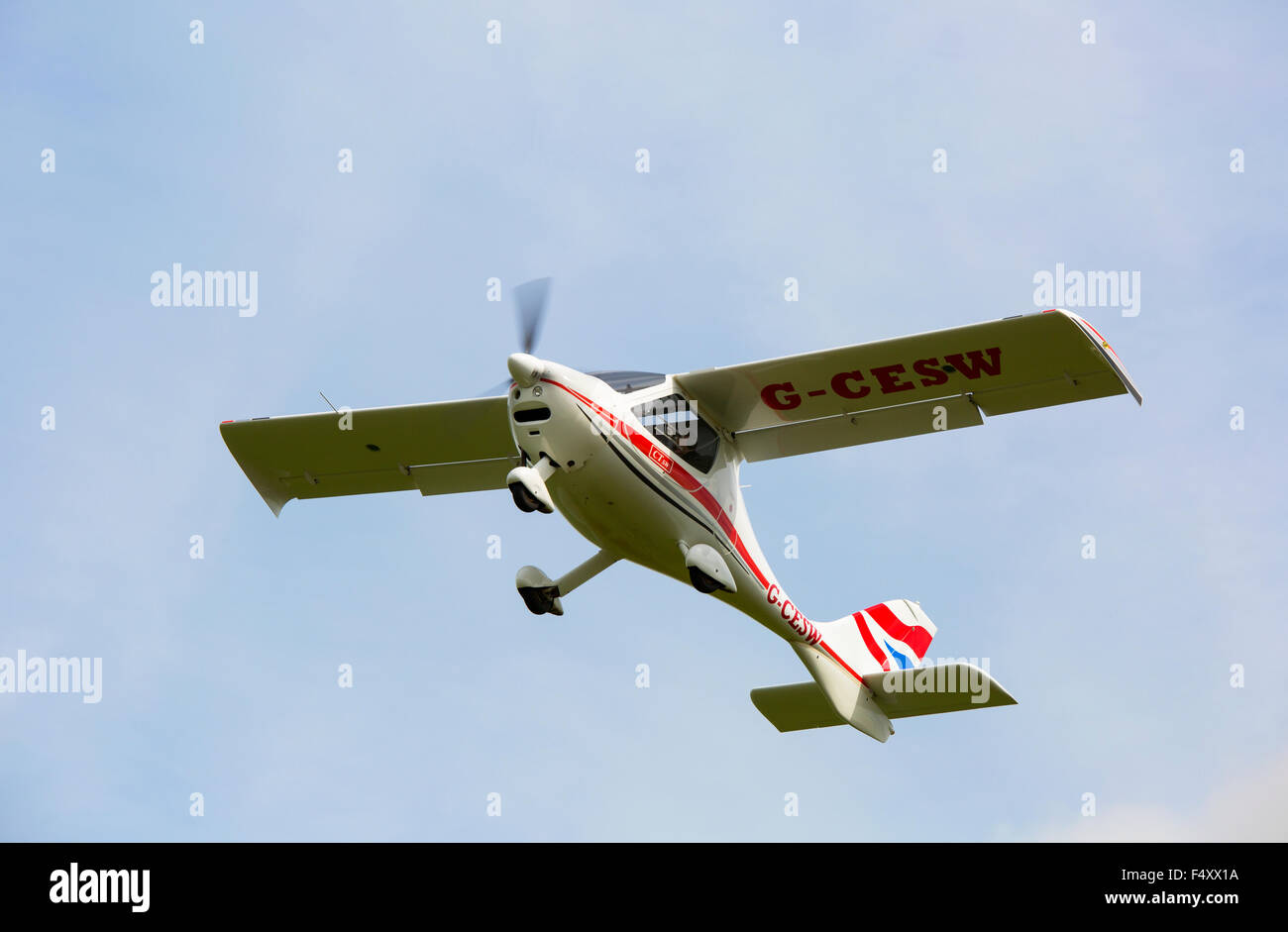 Flight Design CTSW G-CESW in flight taking-off from Breighton Airfield ...