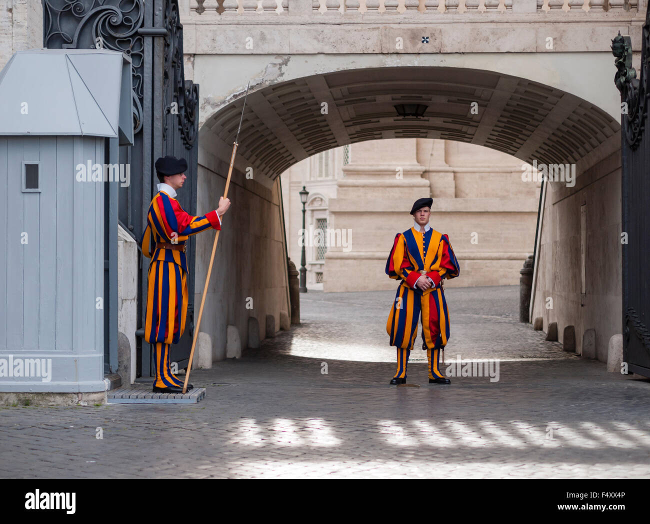 Two members of the Swiss Guard stand sentinel over a side entry to St ...