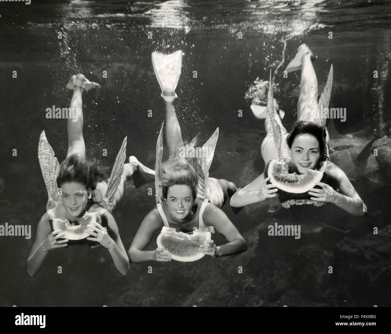 Three American Models eating watermelon underwater, USA Stock Photo - Alamy