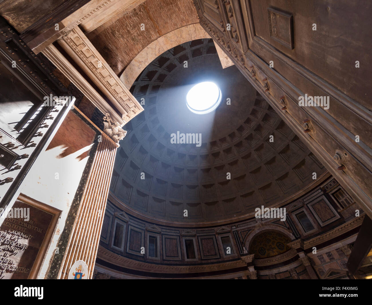 Sunlight is shining into the ancient Roman Pantheon temple through the ...