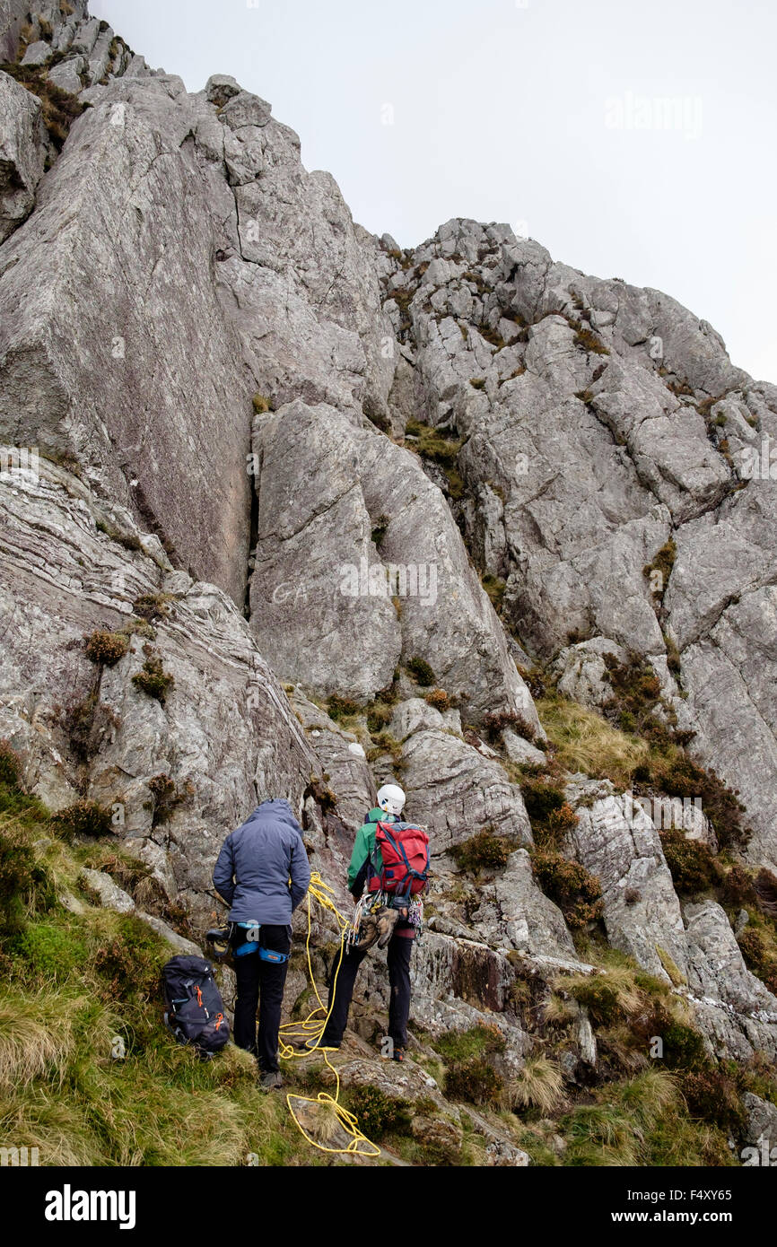 Two rock climbers preparing to climb Grooved Arete HVD 4a on Mount ...
