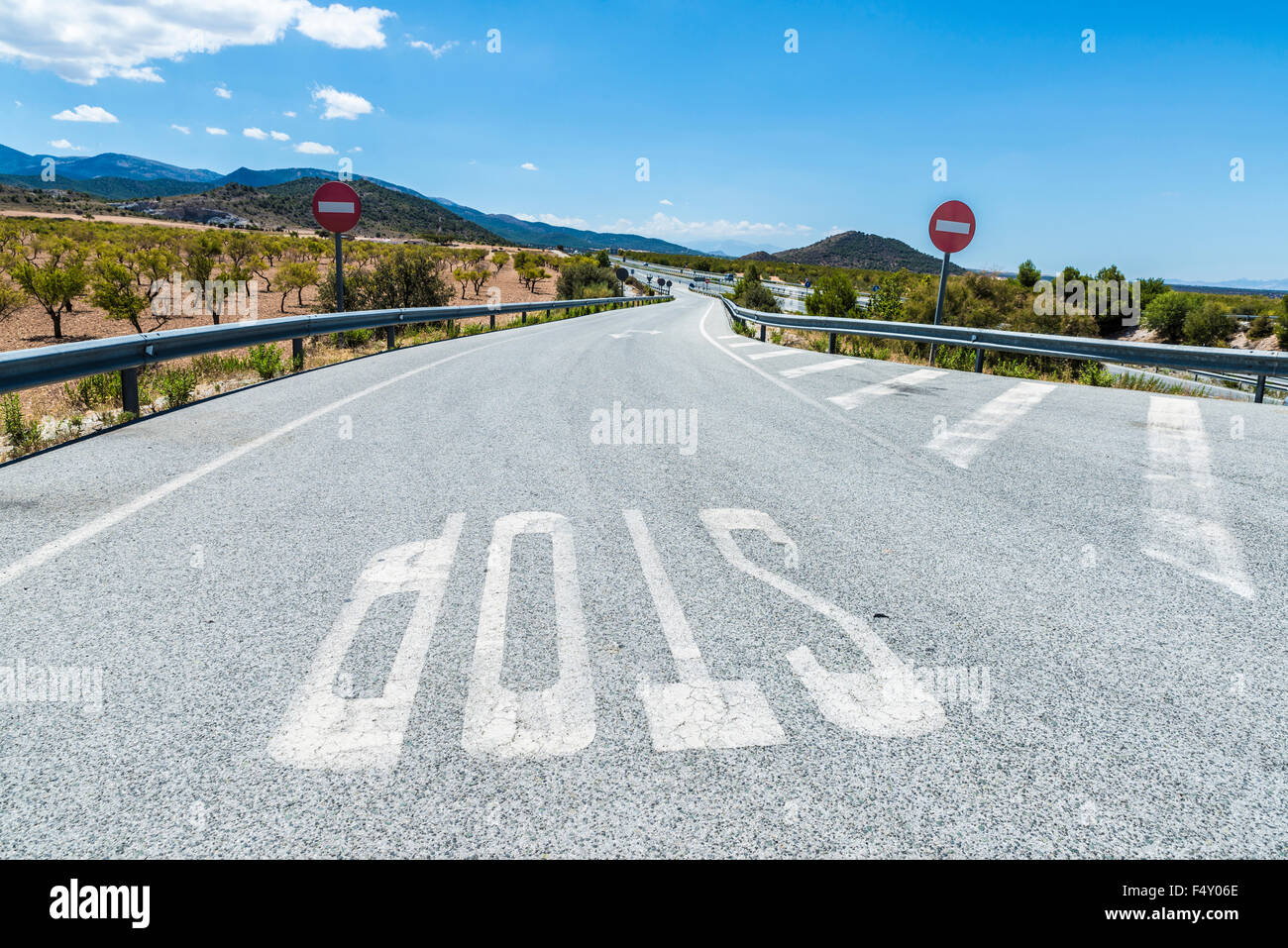 Stop sign and direction sign prohibited on a highway in Spain Stock ...