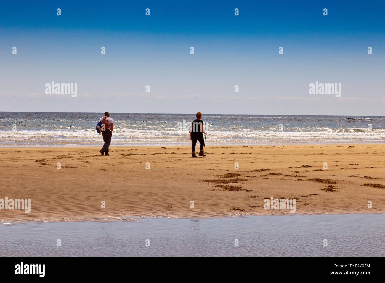 Two beach walkers hi-res stock photography and images - Alamy