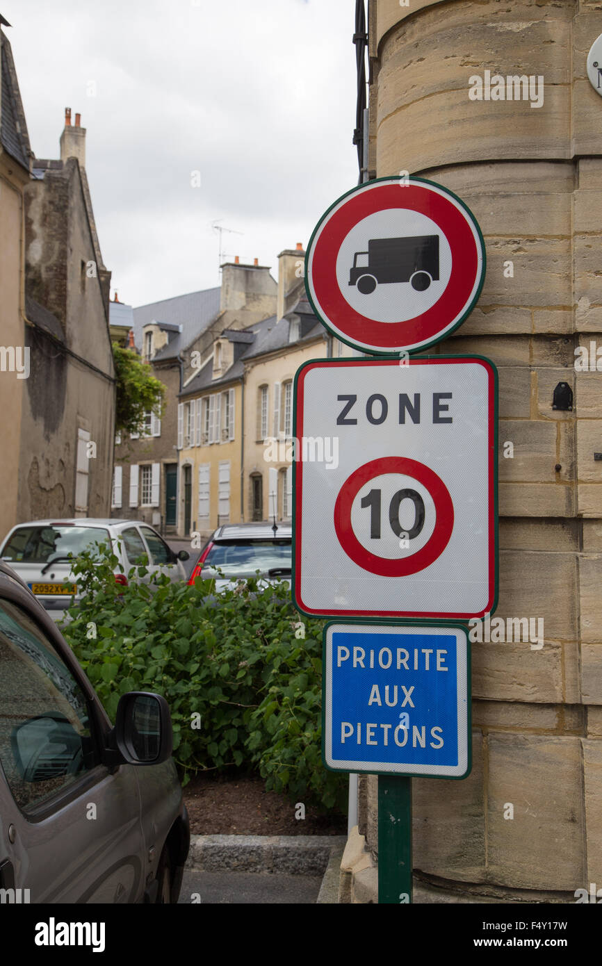 Speed limit restriction road sign on historic Bayeux street scene of ...
