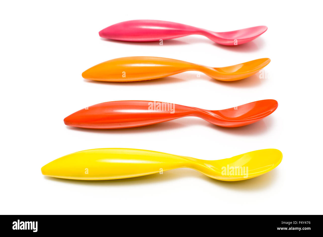 Colorful spoons isolated on white Stock Photo - Alamy