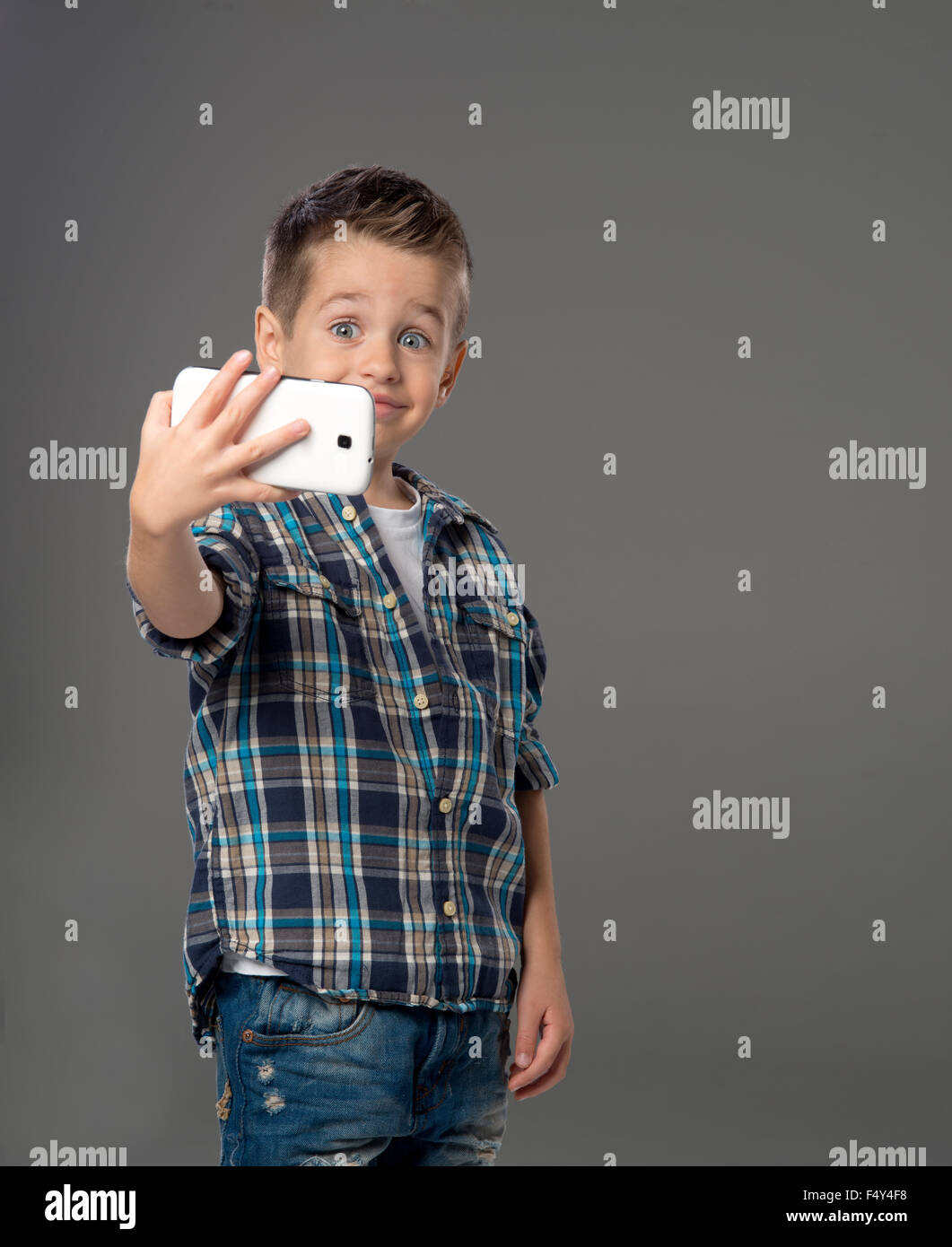 Little boy doing photo of him self over Stock Photo - Alamy