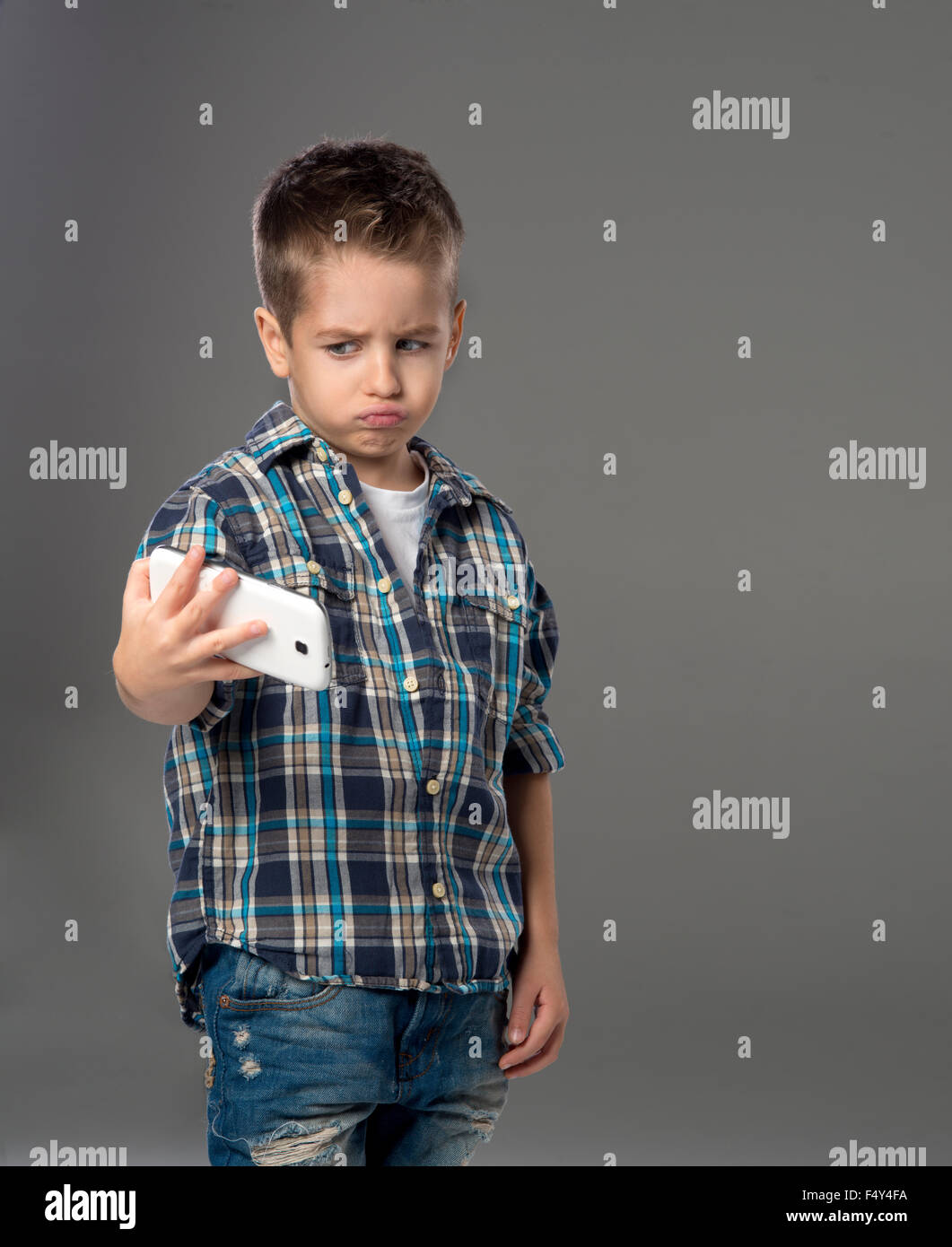 Little boy doing photo of him self over Stock Photo - Alamy