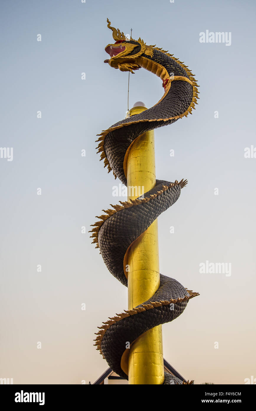 Dragon pillars in the sunset. Shrine Stock Photo - Alamy