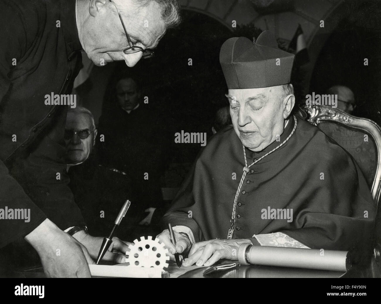 A cardinal signing cards, Italy Stock Photo - Alamy