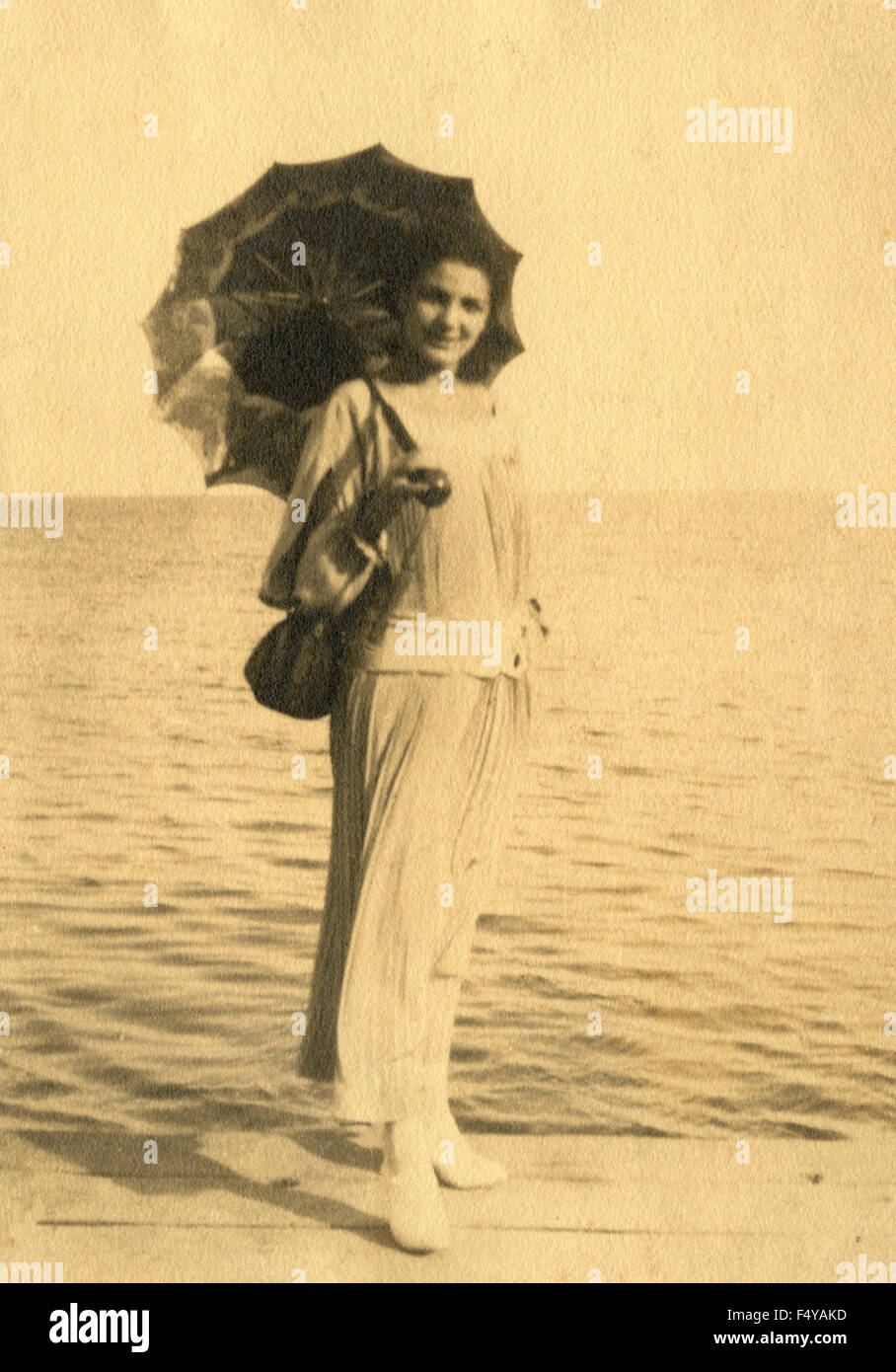 Woman with a parasol hi-res stock photography and images - Alamy