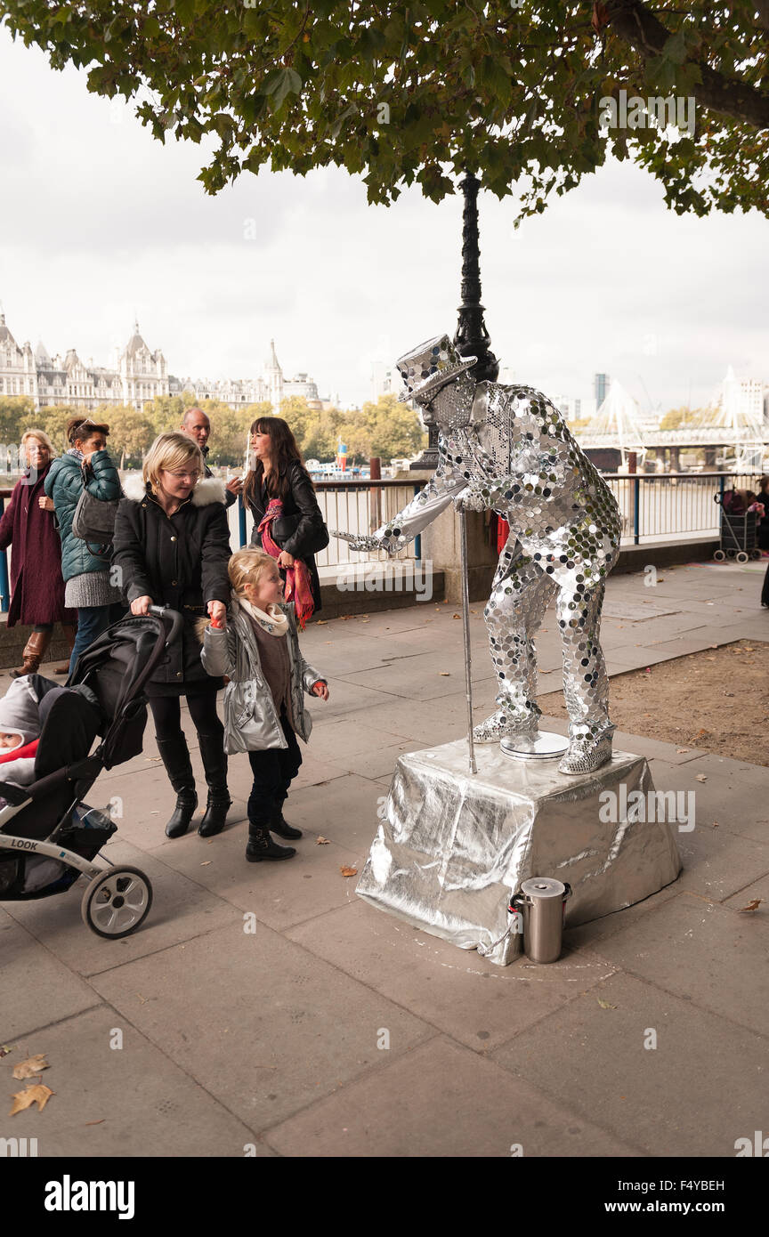mirror man statue street performer coated in small reflective shiny ...