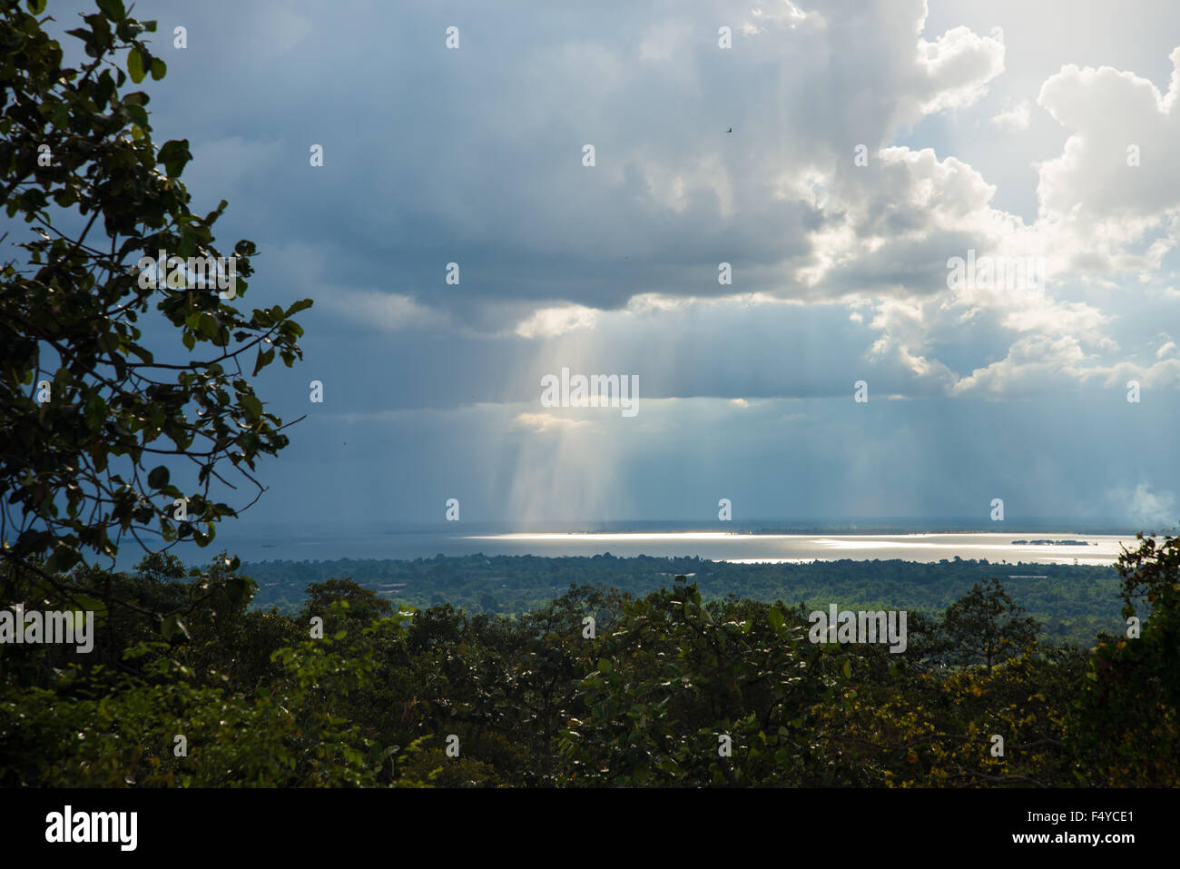 Mostly cloudy and sunny through the clouds Stock Photo - Alamy