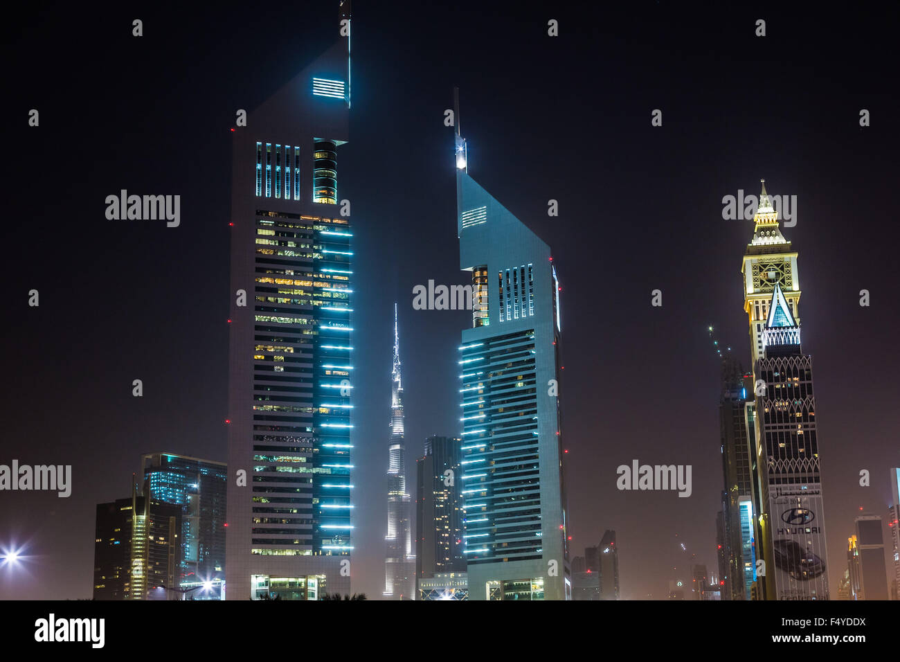 DUBAI - APRIL 18: Emirates Towers and Burj Khalifa at night time, 18 ...