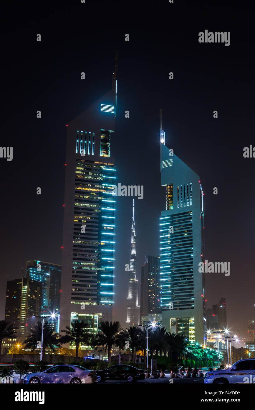 DUBAI - APRIL 18: Emirates Towers and Burj Khalifa at night time, 18 ...