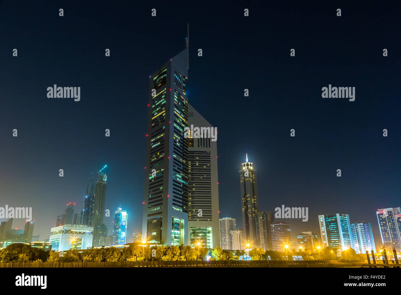 DUBAI - APRIL 18: Emirates Towers and Burj Khalifa at night time, 18 ...