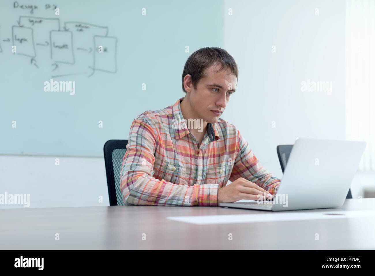Businessman working laptop sitting office desk Stock Photo - Alamy Businessman working laptop sitting office desk Stock Photo - Alamy