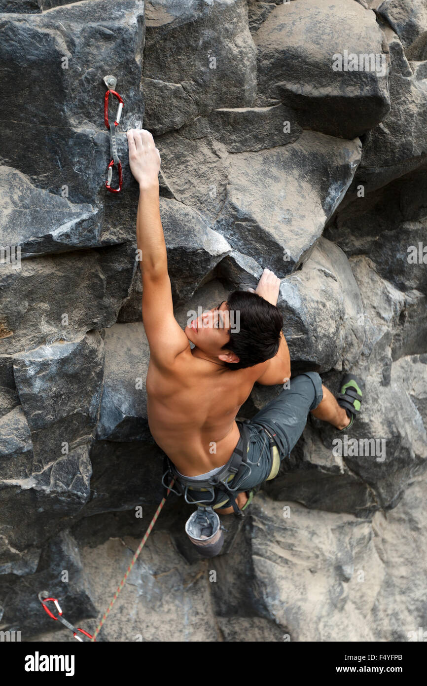 Rock Climber Searching For A Connecting Spot Stock Photo - Alamy