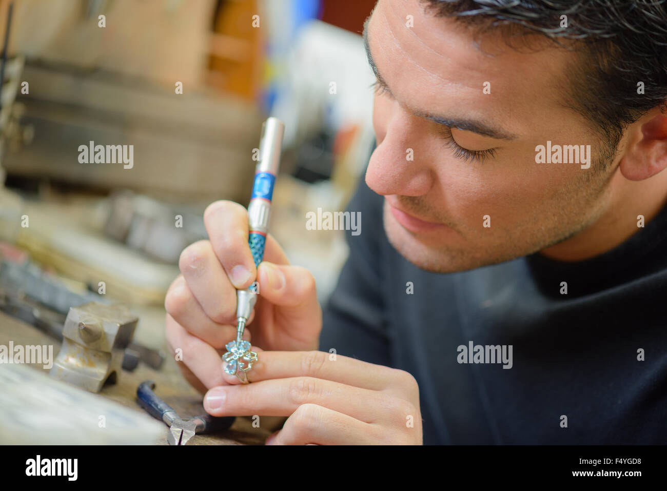 Man making jewellery Stock Photo - Alamy