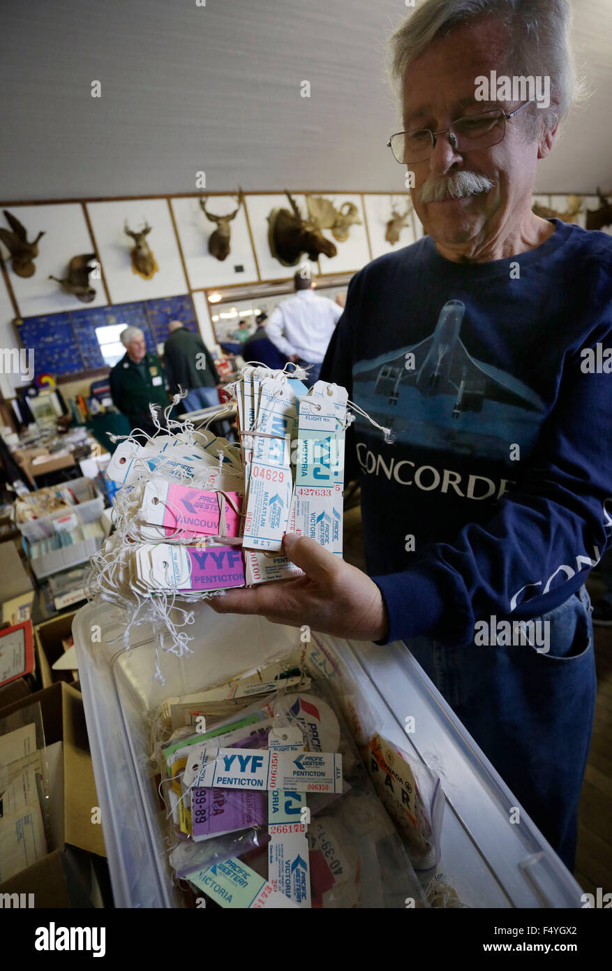 Vancouver. 24th Oct, 2015. An aviation collector shows baggage tags of ...