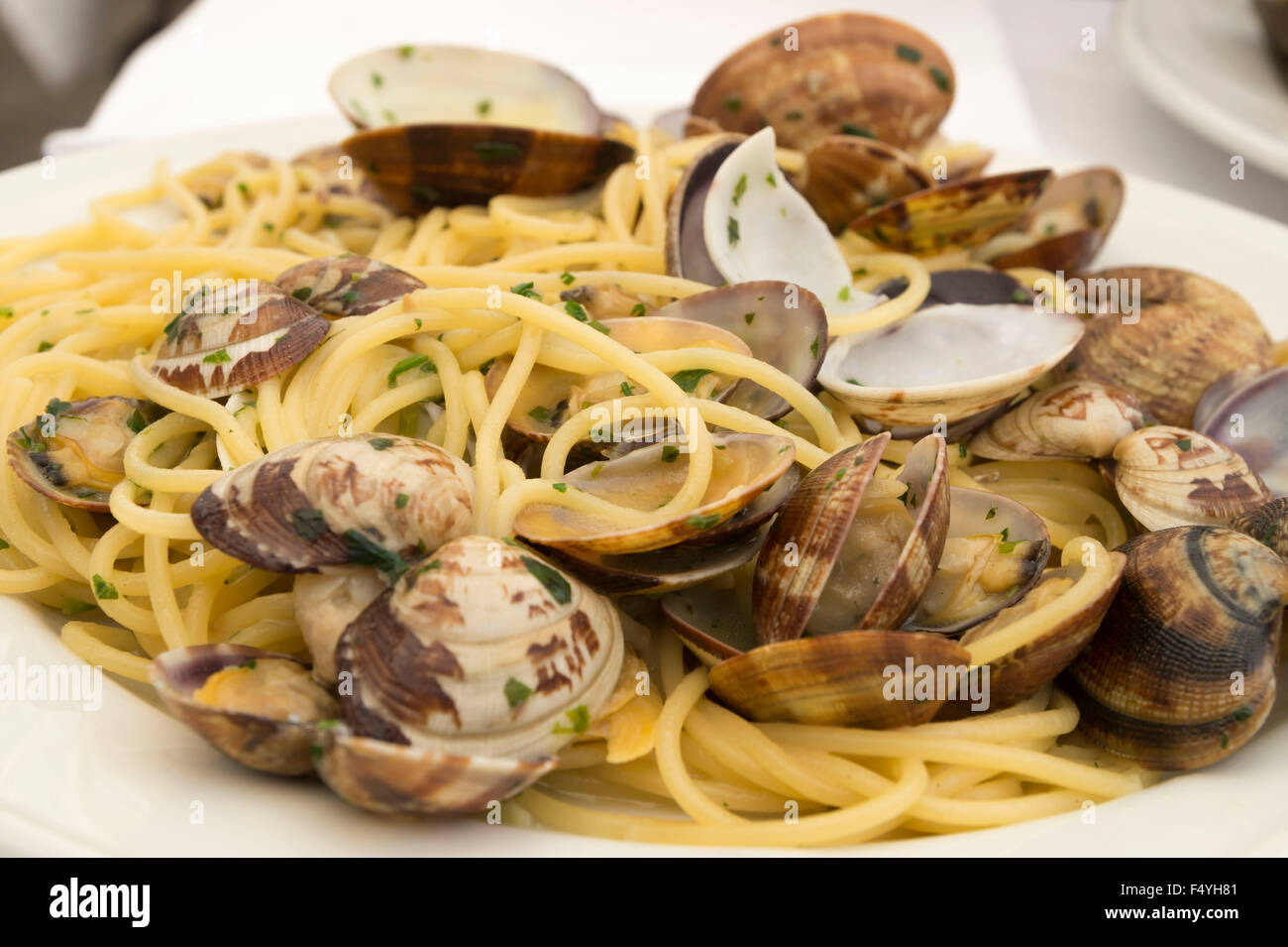 Italian food. Delicious spaghetti with clams Stock Photo - Alamy