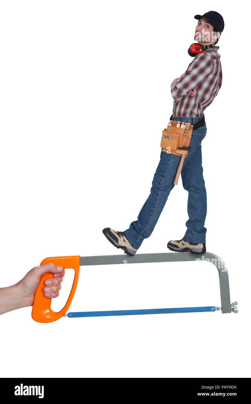 Worker standing on a saw Stock Photo - Alamy
