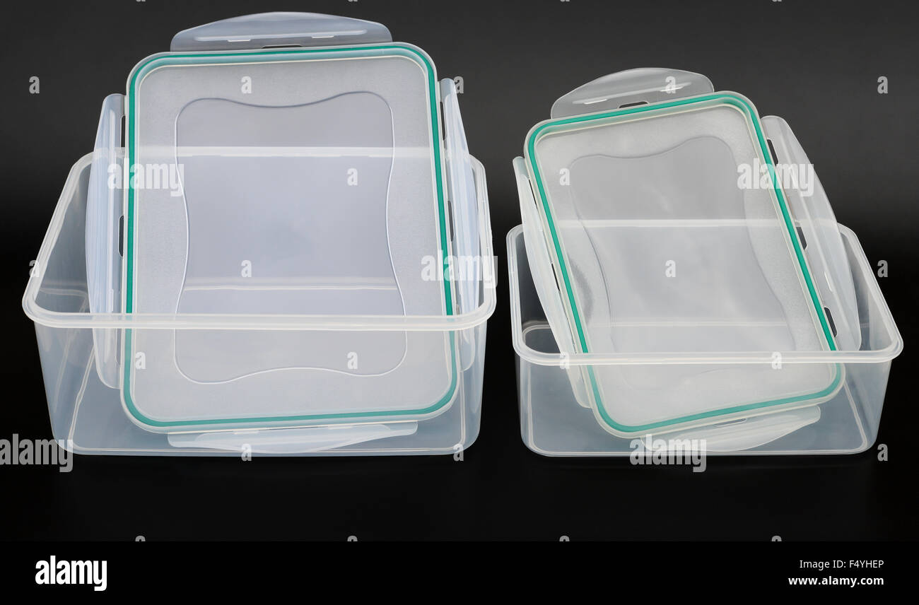 translucent storage boxes with lips opened on a black background Stock ...
