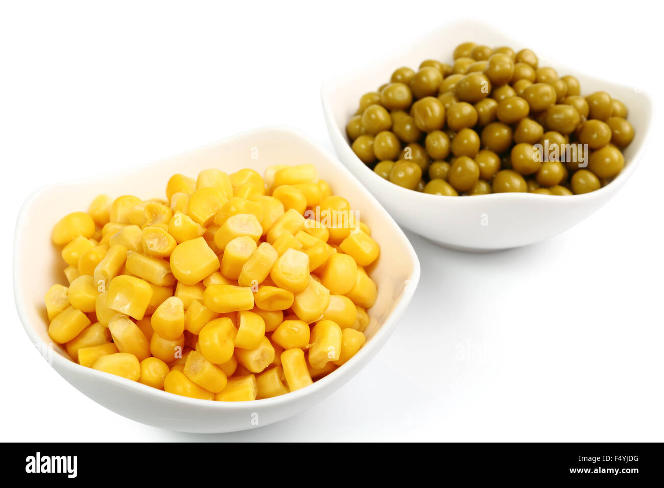 Canned Corn and Canned Green Peas Stock Photo - Alamy