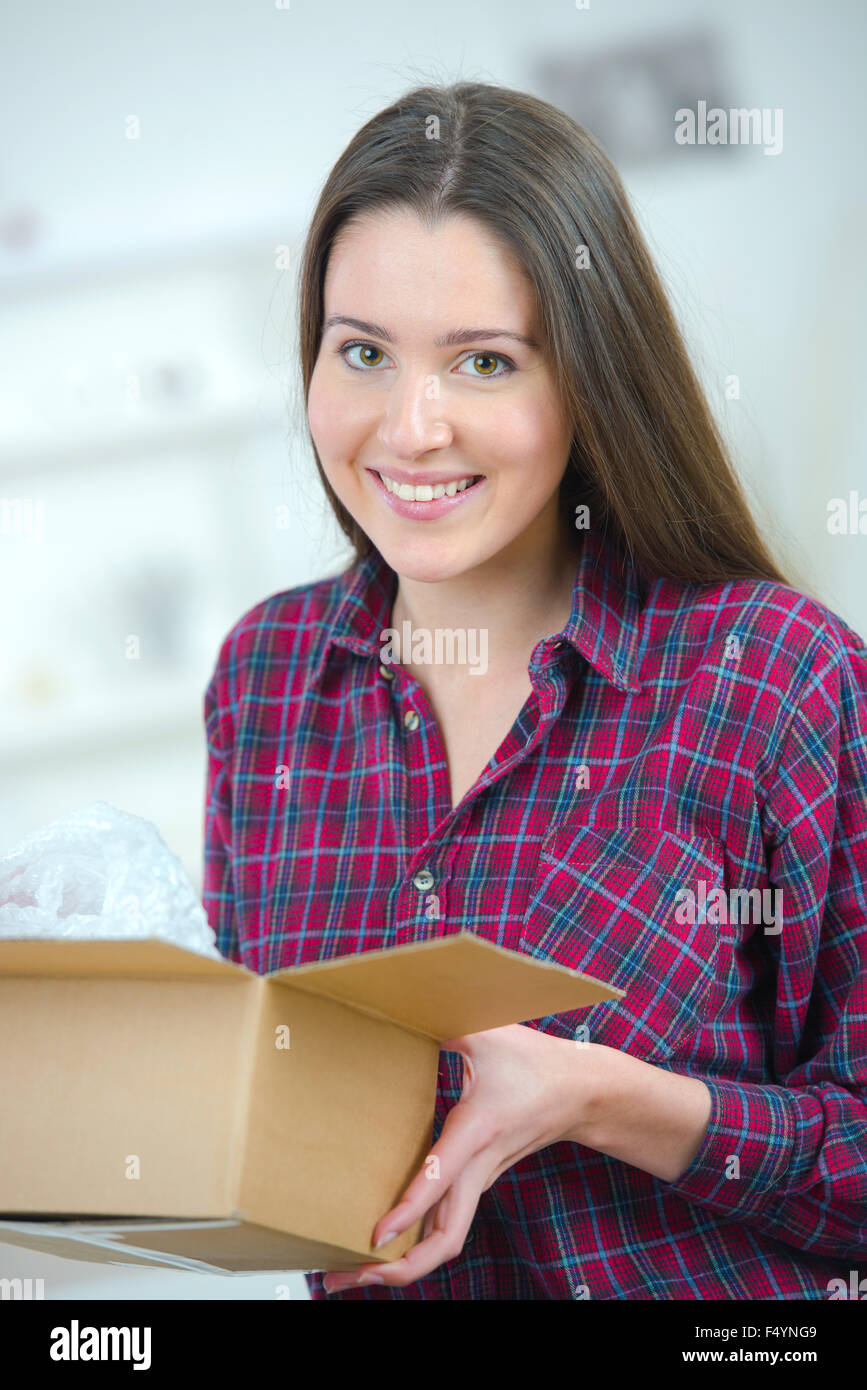 Woman holding a cardboard box Stock Photo - Alamy