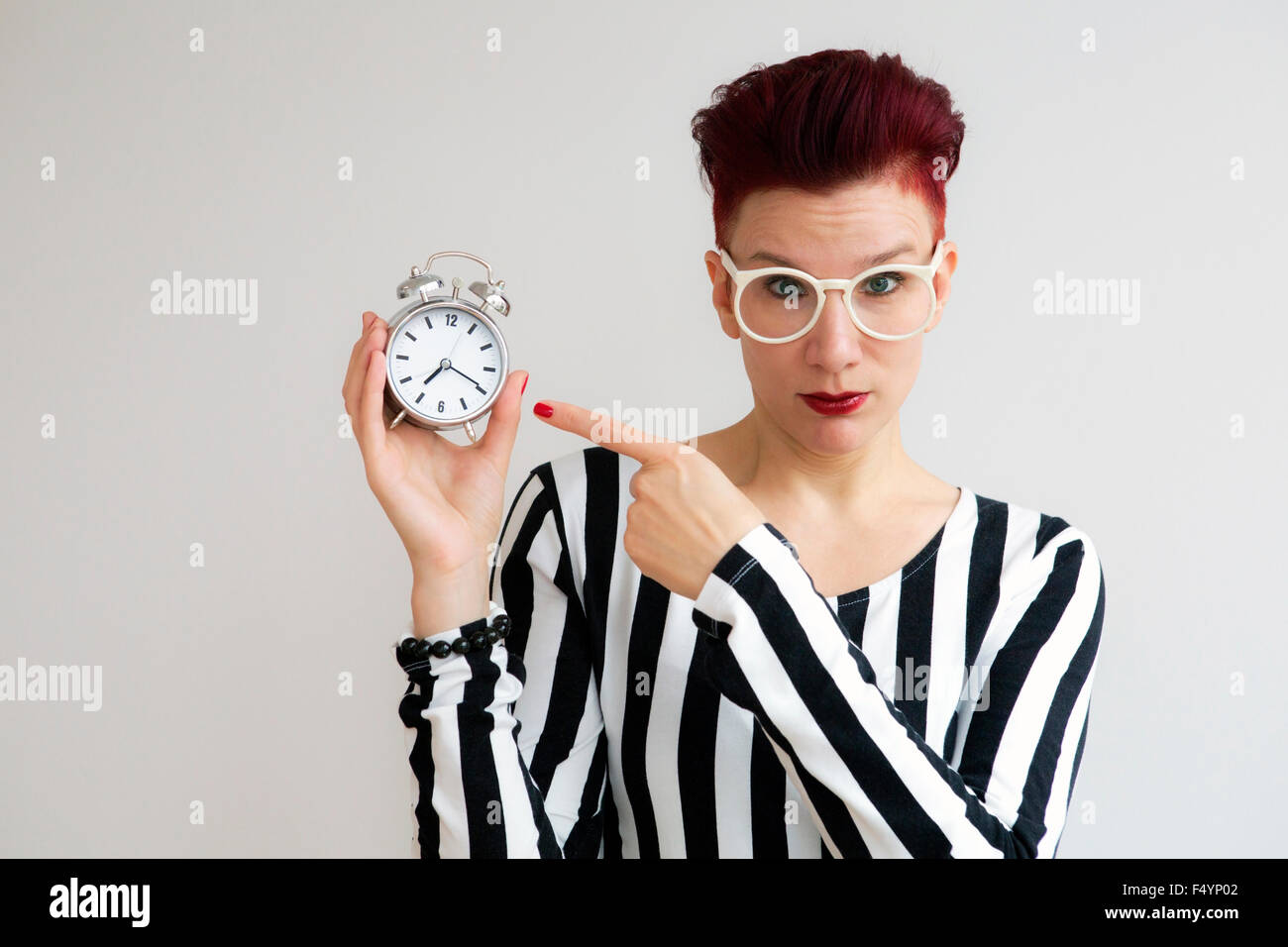 Pointing clock hi-res stock photography and images - Alamy