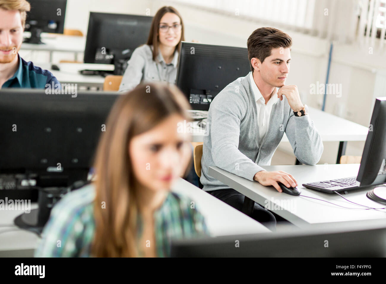 Young people in the classroom Stock Photo - Alamy