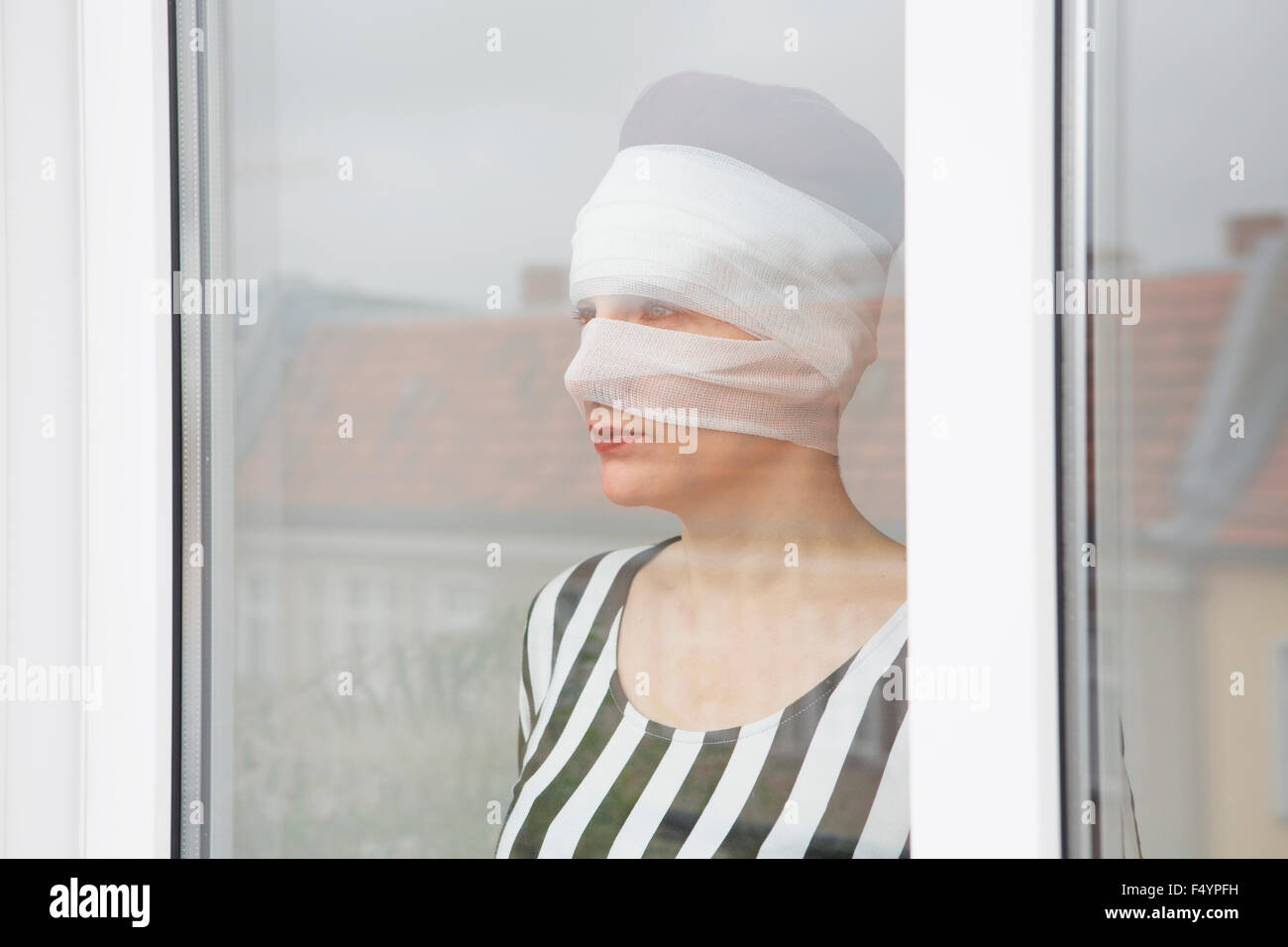 portrait of woman with bandage around face and red lips Stock Photo - Alamy