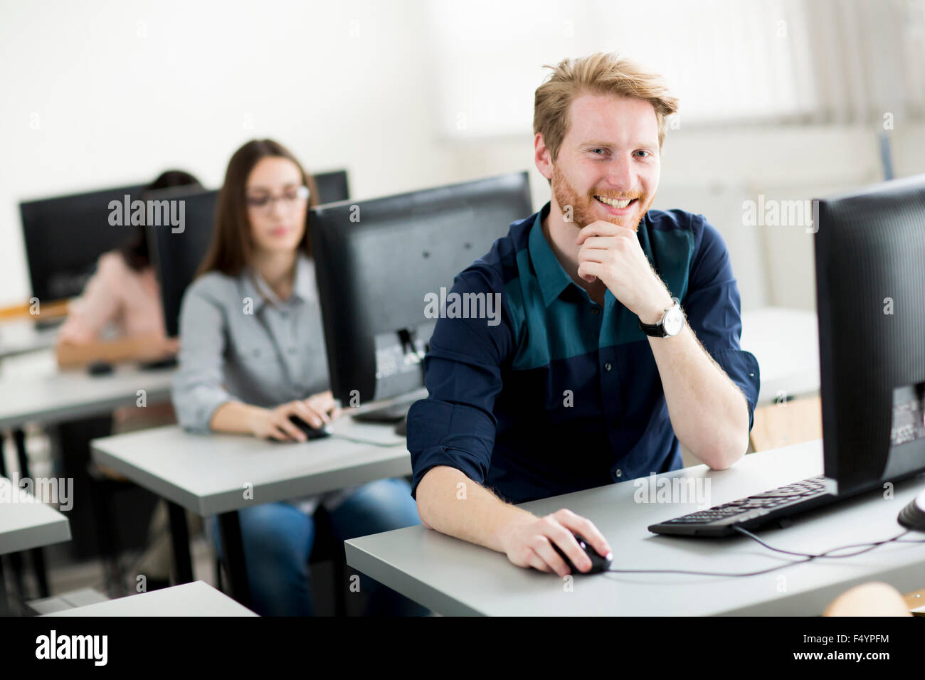 Young people in the classroom Stock Photo - Alamy