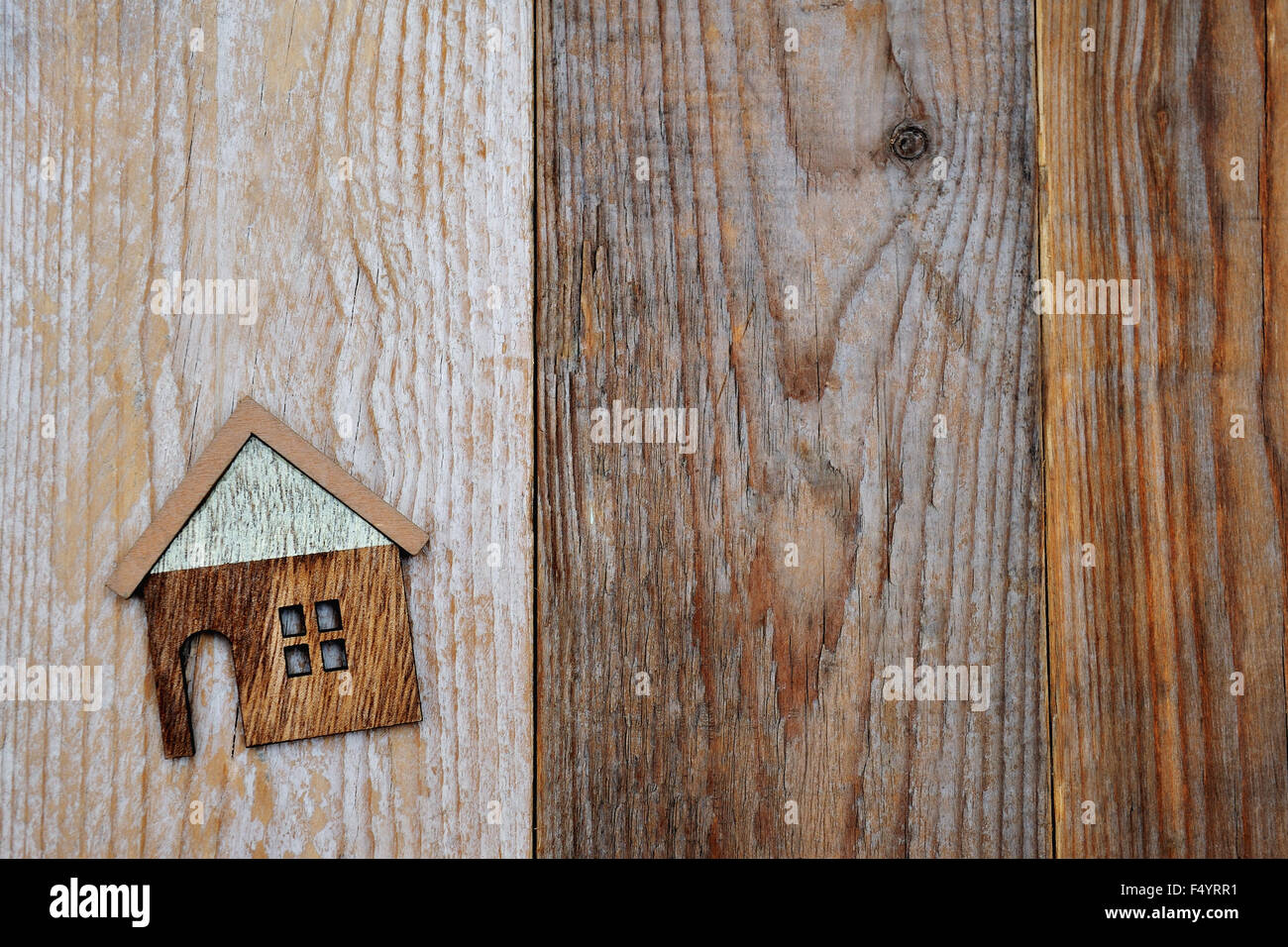 little house on wooden background Stock Photo - Alamy