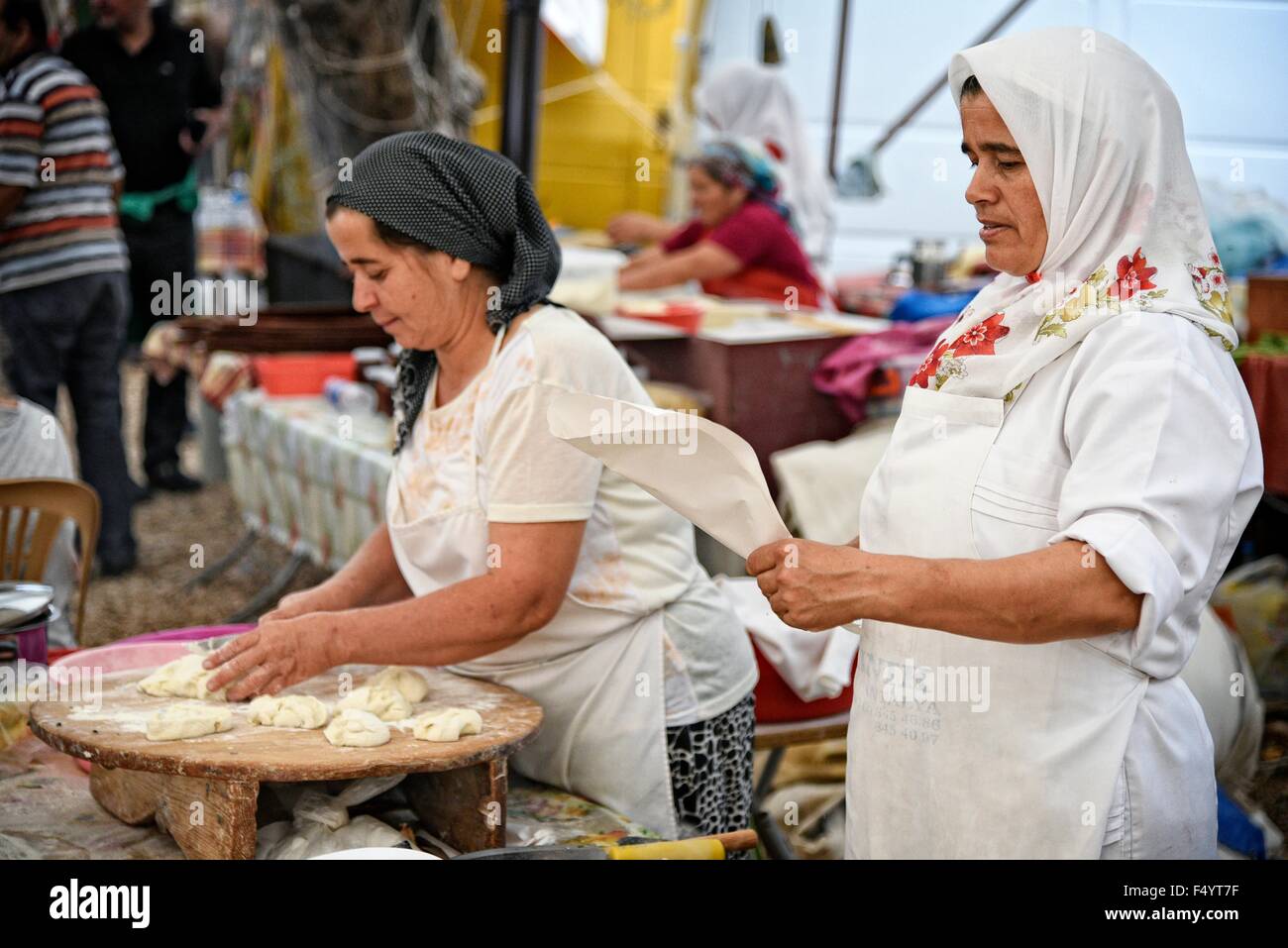 KAS Antalya Turkey Friday Market making traditional pancakes on a cast ...
