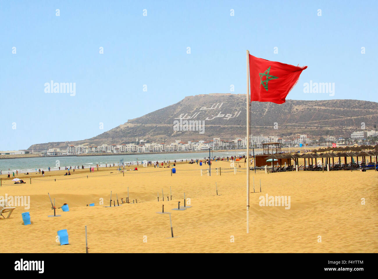 The beautiful beach in Agadir with flag of Morocco Stock Photo - Alamy