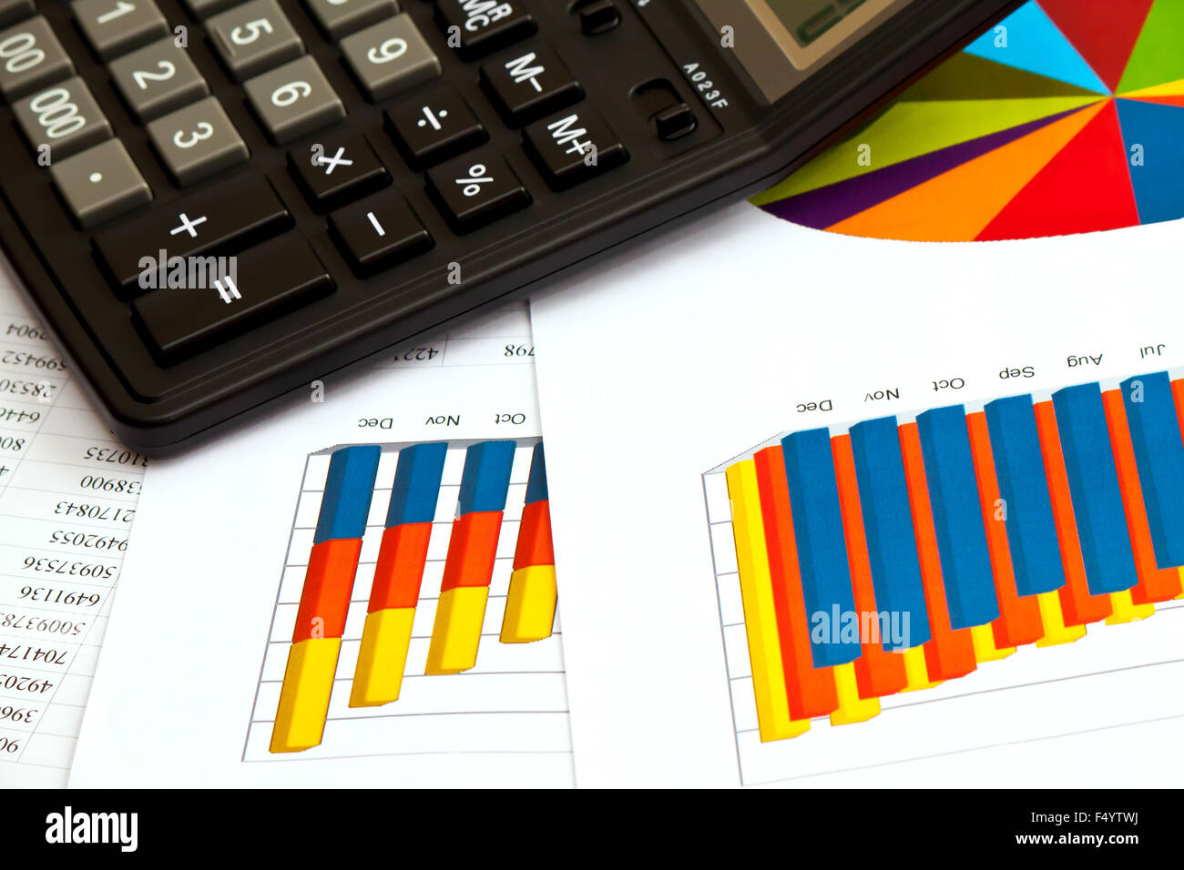 Business picture: calculator and financial graphs Stock Photo - Alamy