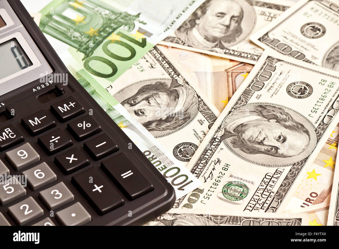 Business picture: money and calculator over white Stock Photo - Alamy