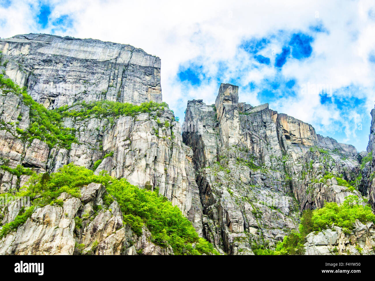 View up a gigantic rock in Lysefjord, famous as Preikestolen - or ...