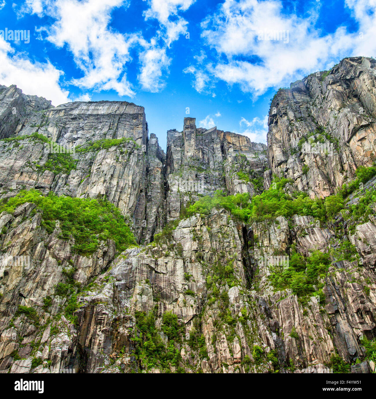 View up a gigantic rock in Lysefjord, famous as Preikestolen - or ...