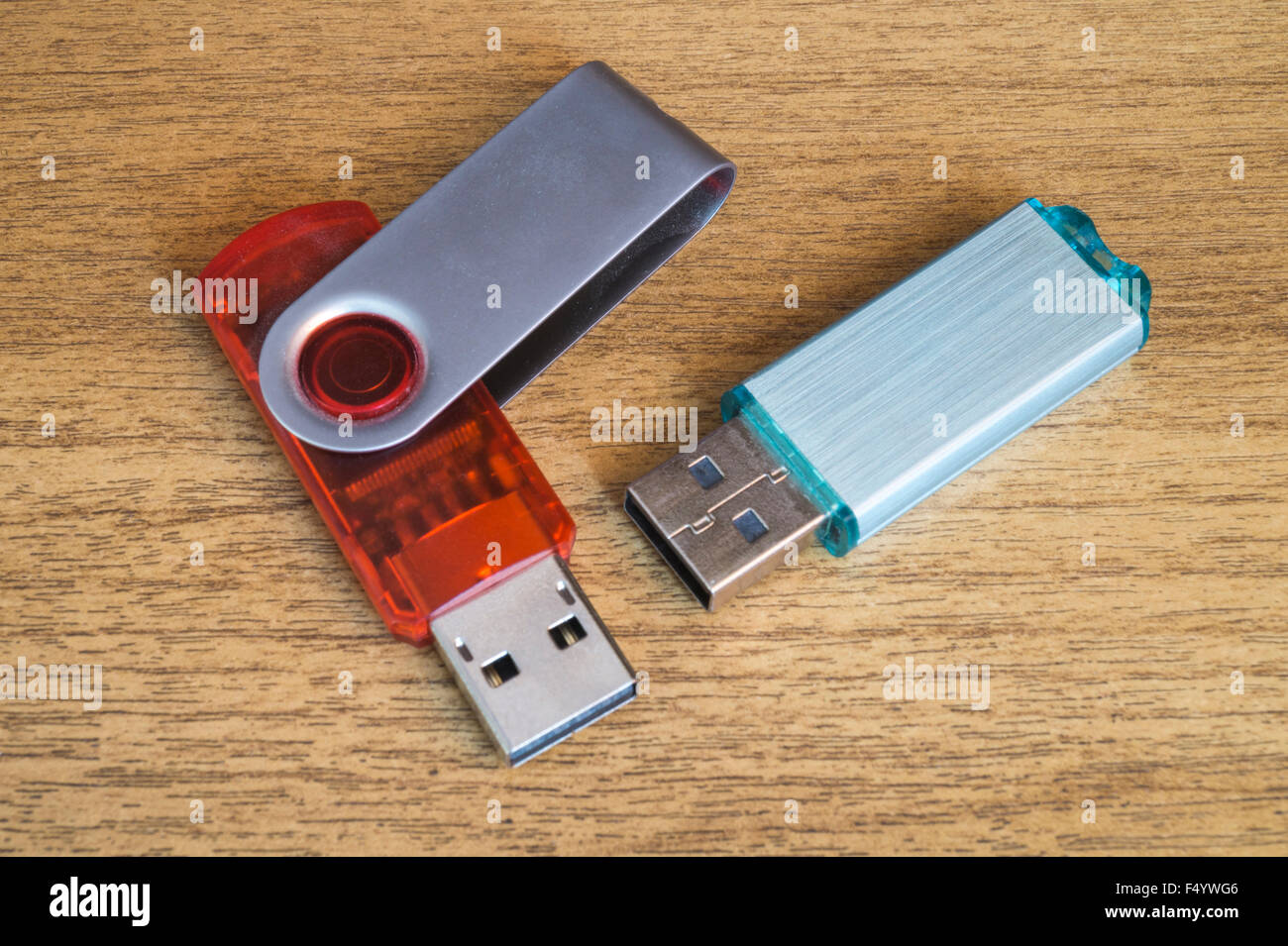 Fleshka for keeping of information rests upon wooden table Stock Photo ...