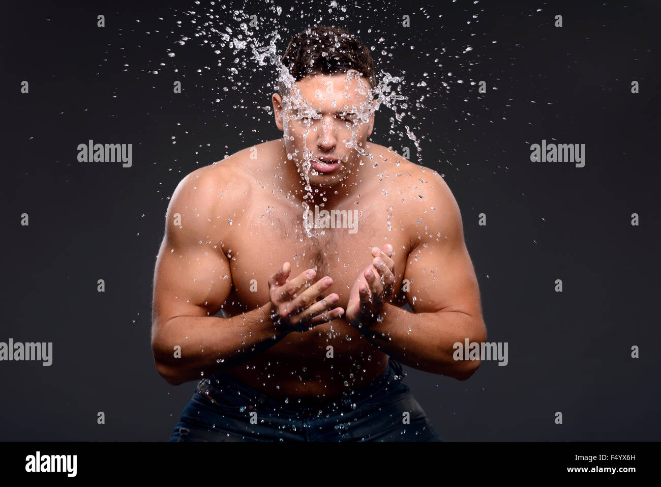 Handsome guy taking shower Stock Photo - Alamy