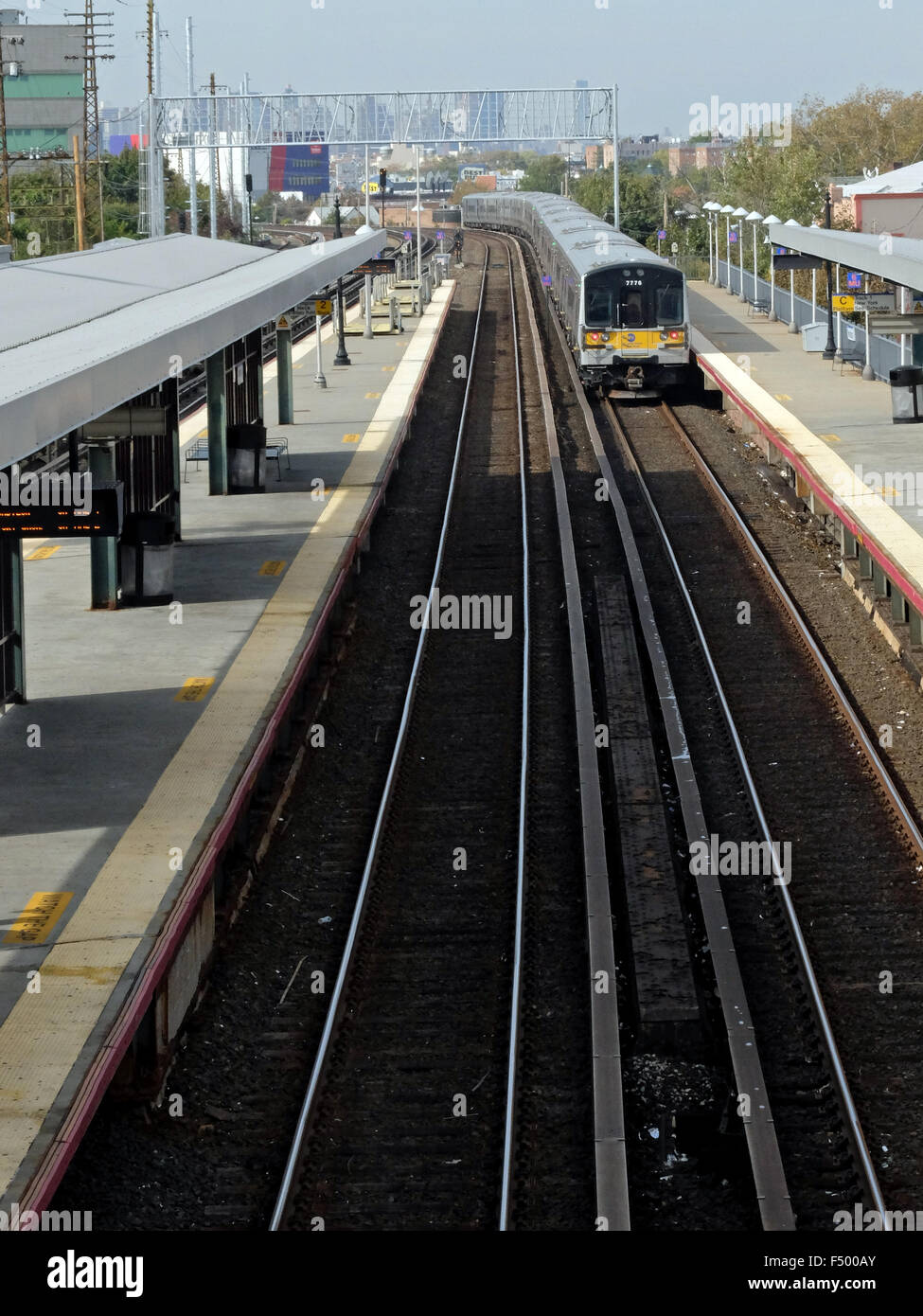 A Long Island railroad train pulls out of the Woodside, Queens station ...