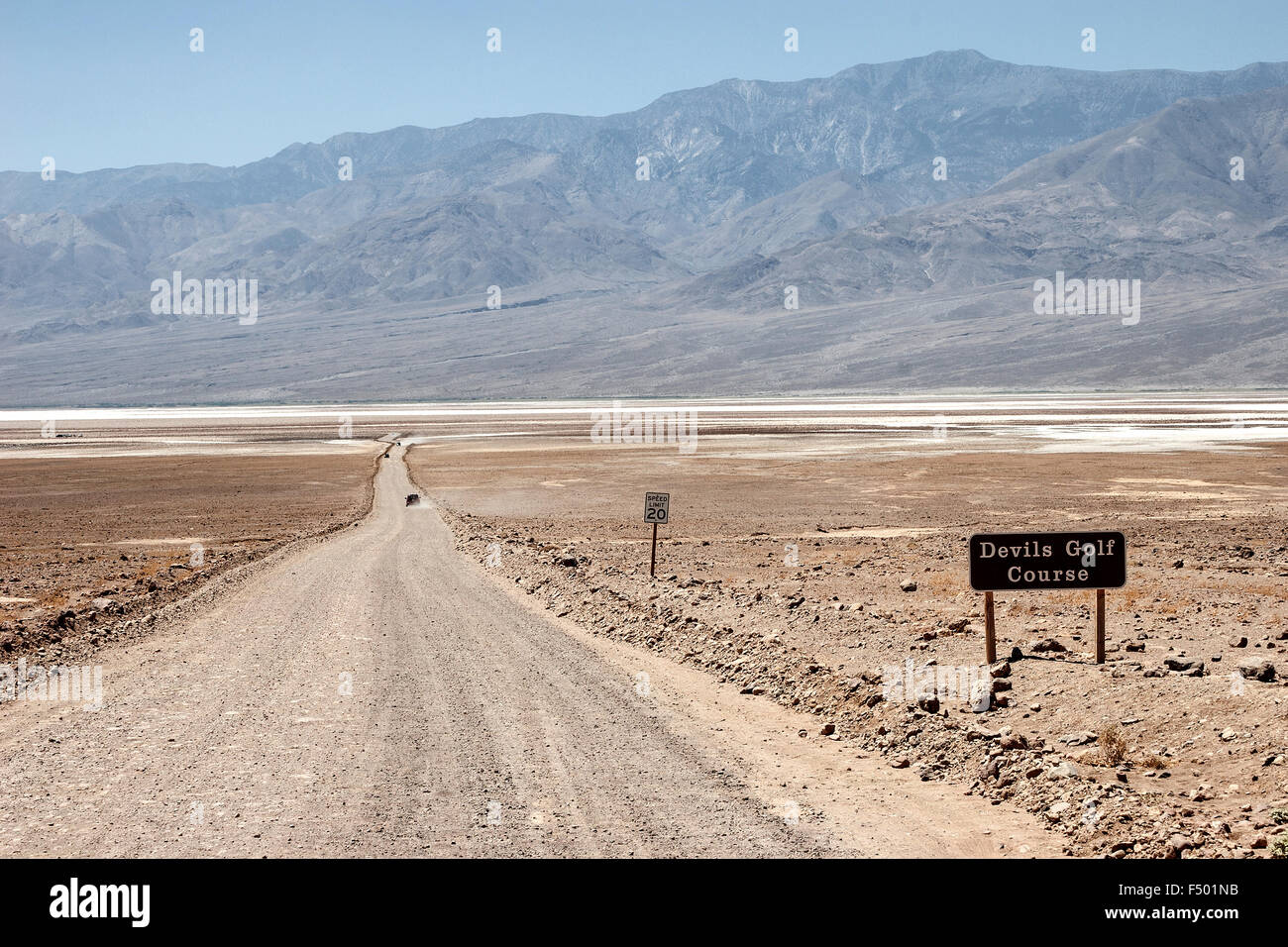 Gravel road to Devil's Golf Course, Panamint Range behind, Black ...