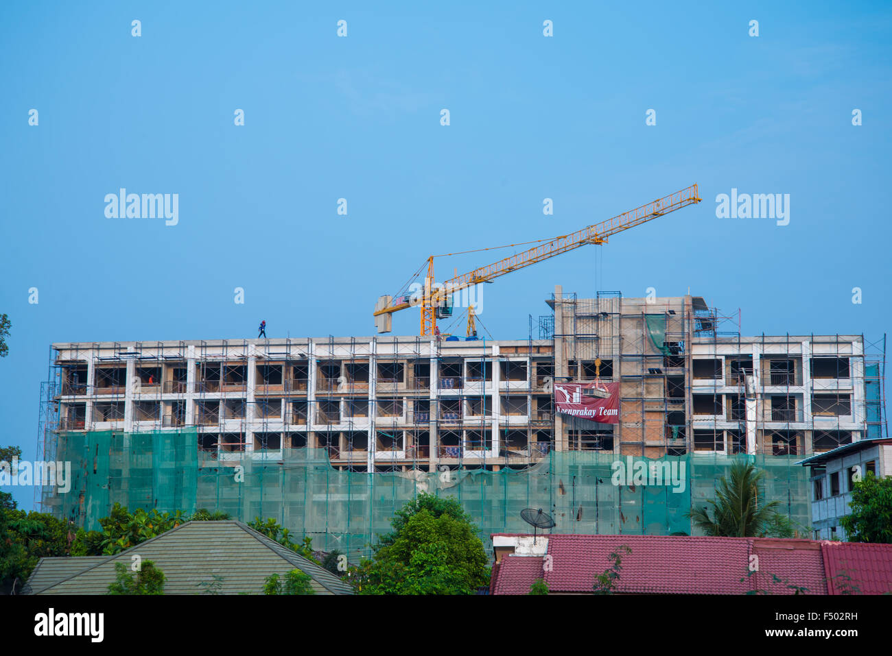 Derrick is used in the construction of tall buildings Stock Photo - Alamy