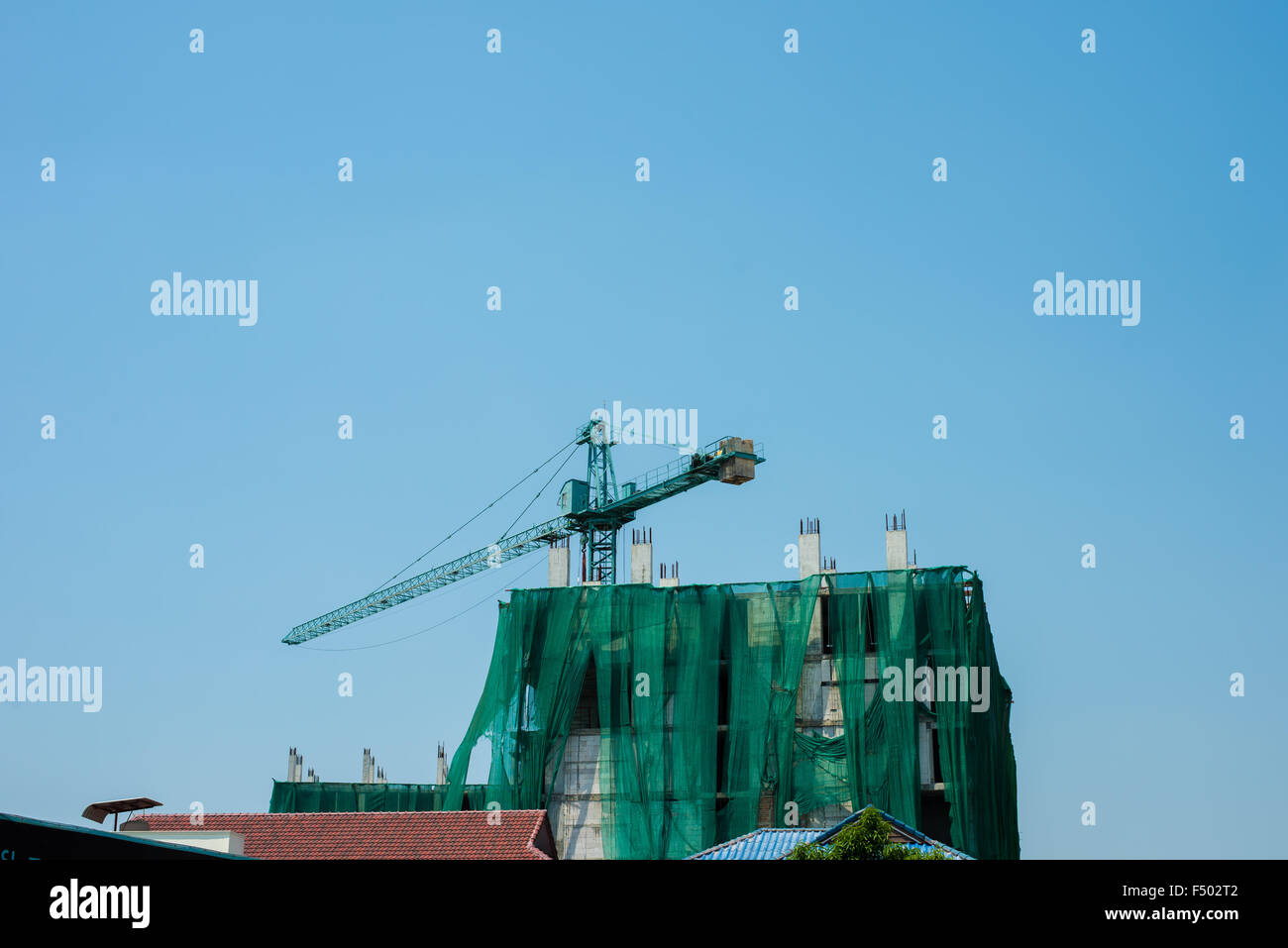 Derrick is used in the construction of tall buildings Stock Photo - Alamy
