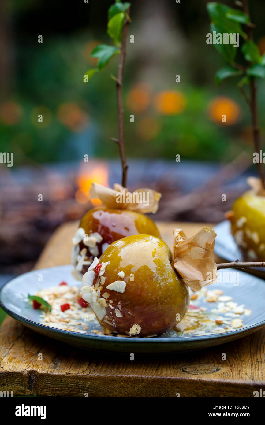 Toffee apples and a bonfire in the background Stock Photo - Alamy