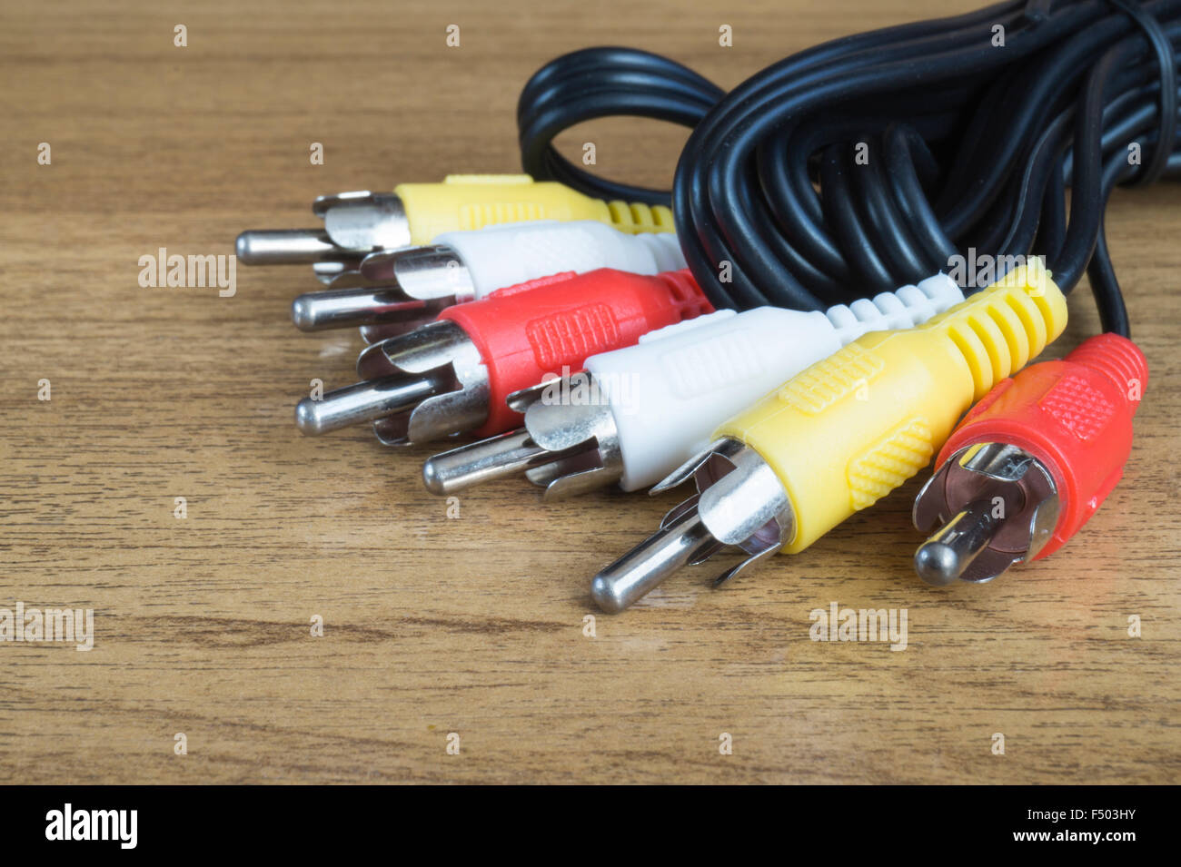 Group of the patchcords with connector rests upon wooden table Stock ...