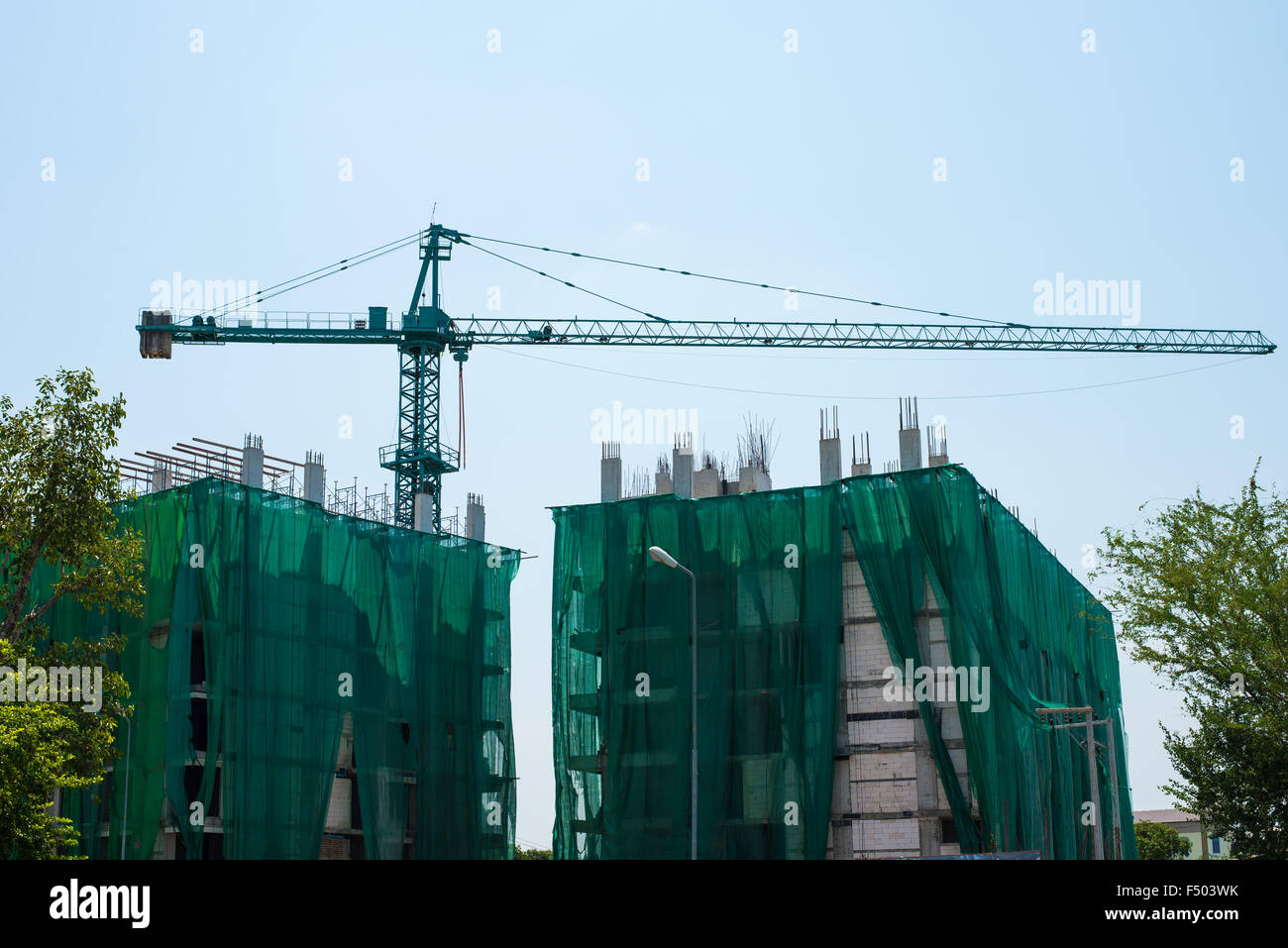 Derrick is used in the construction of tall buildings Stock Photo - Alamy