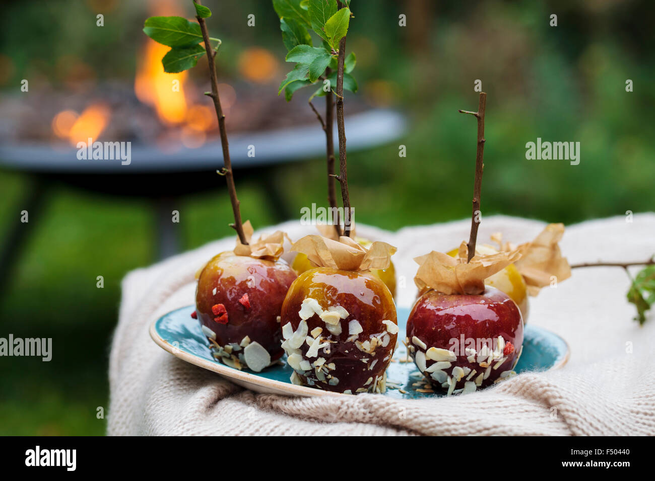 Toffee apples and a bonfire in the background Stock Photo - Alamy