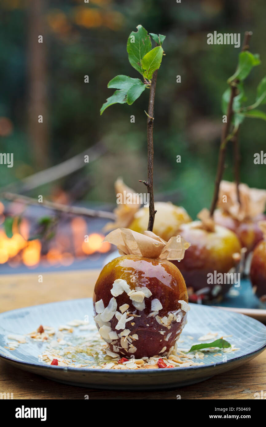 Toffee apples and a bonfire in the background Stock Photo - Alamy